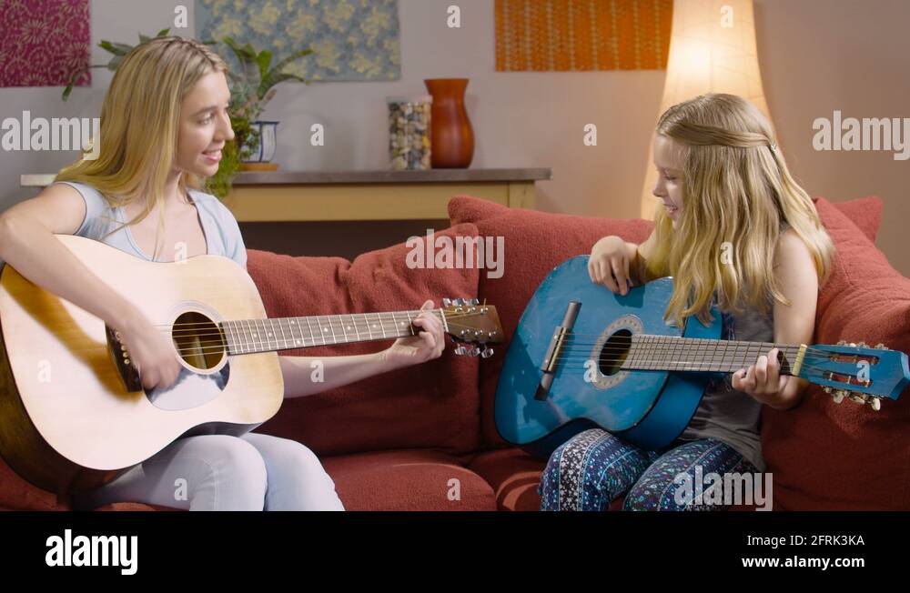 Girls playing guitars Stock Videos & Footage - HD and 4K Video Clips ...
