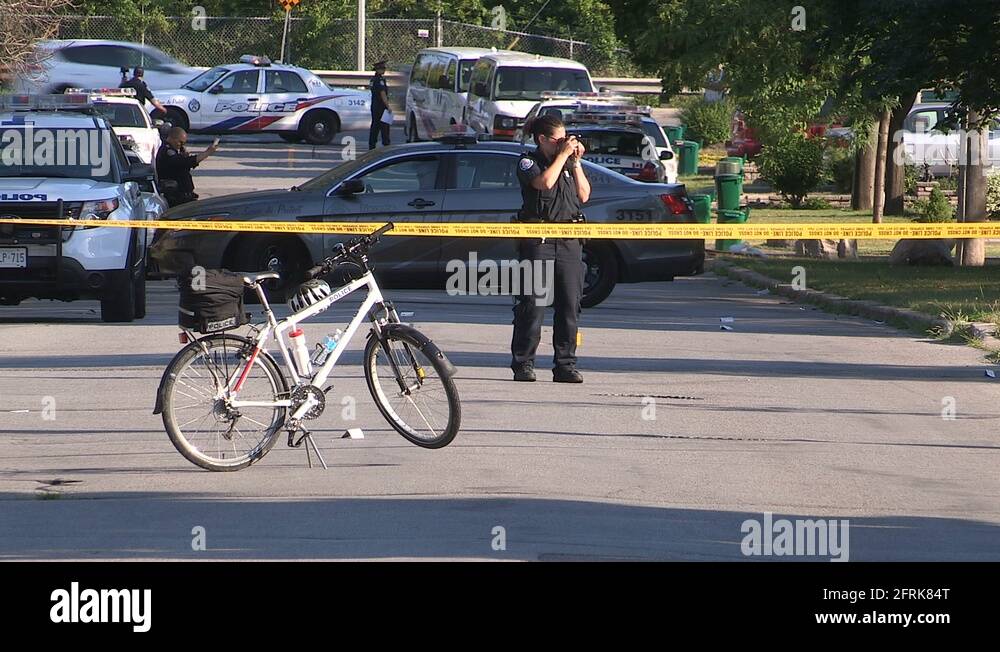 Toronto police officers at gun crime and shooting murder scene Stock ...