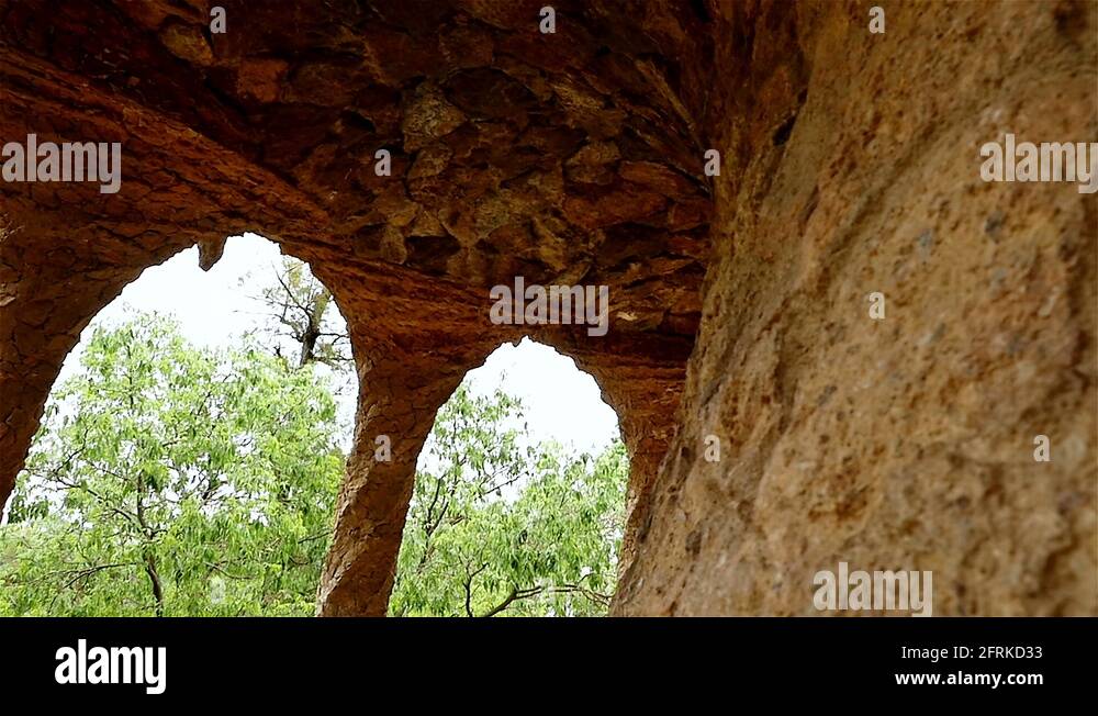 Colonnaded path under roadway viaduct in Antoni Gaudi's Park Guell ...