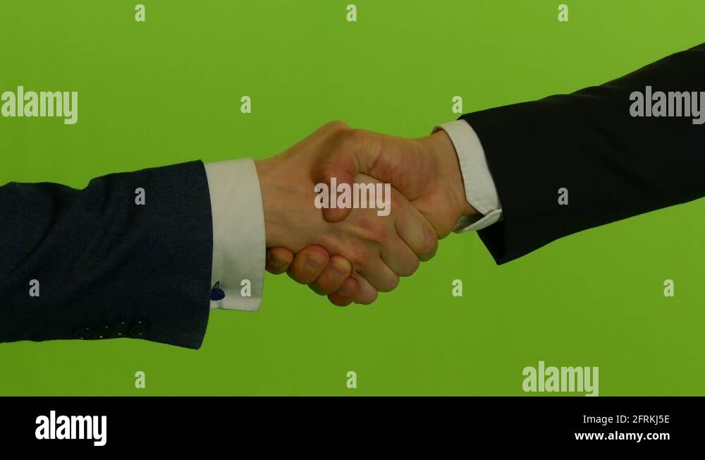 handshaking businessman's against green screen background Stock Video ...