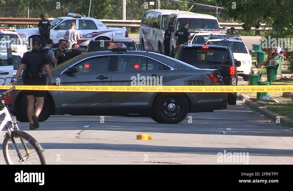 Toronto police officers at gun crime and shooting murder scene Stock ...