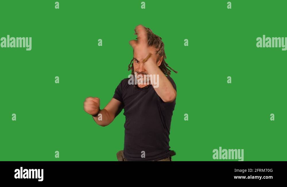martial artist fighting in slow motion isolated on green screen ...