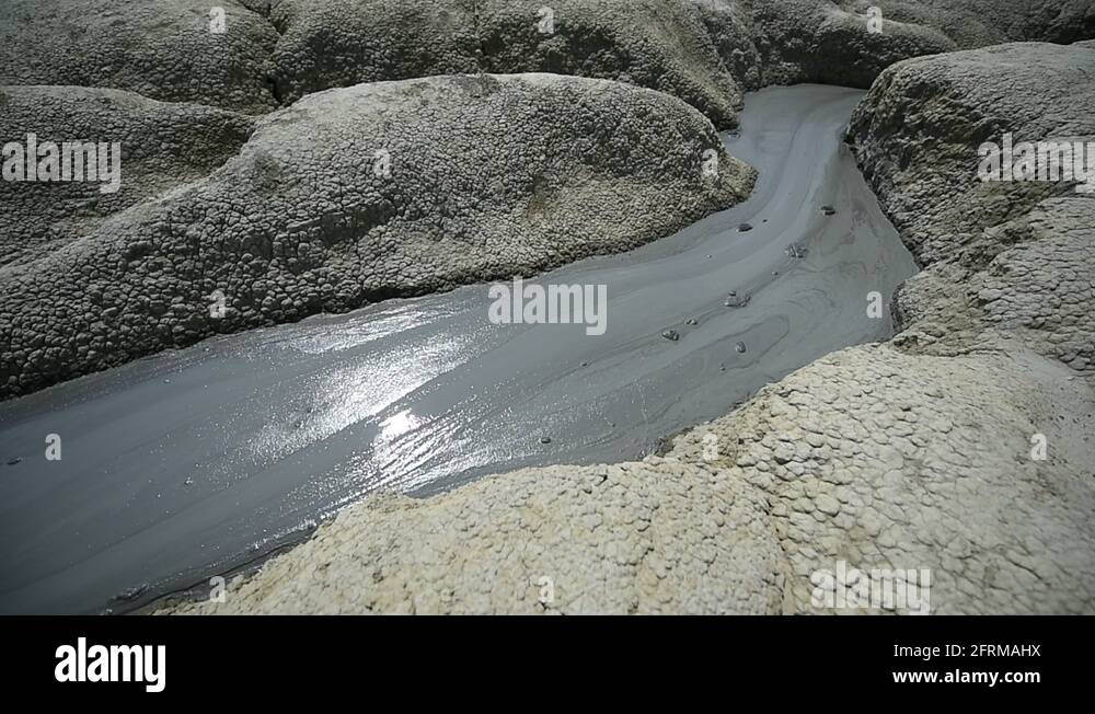 Mud volcanoes also known as mud domes erupting in summer season Stock ...