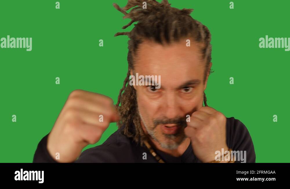 man boxing against camera isolated on green screen background Stock ...