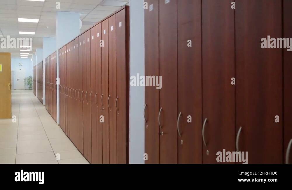 Long corridor with a many cabinets and the opened door Stock Video ...