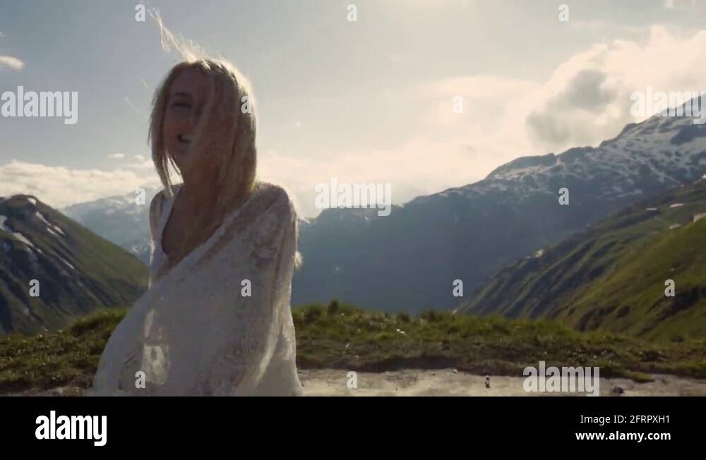 Smile on the face, wind in the hair, girl on the top of the mountain ...