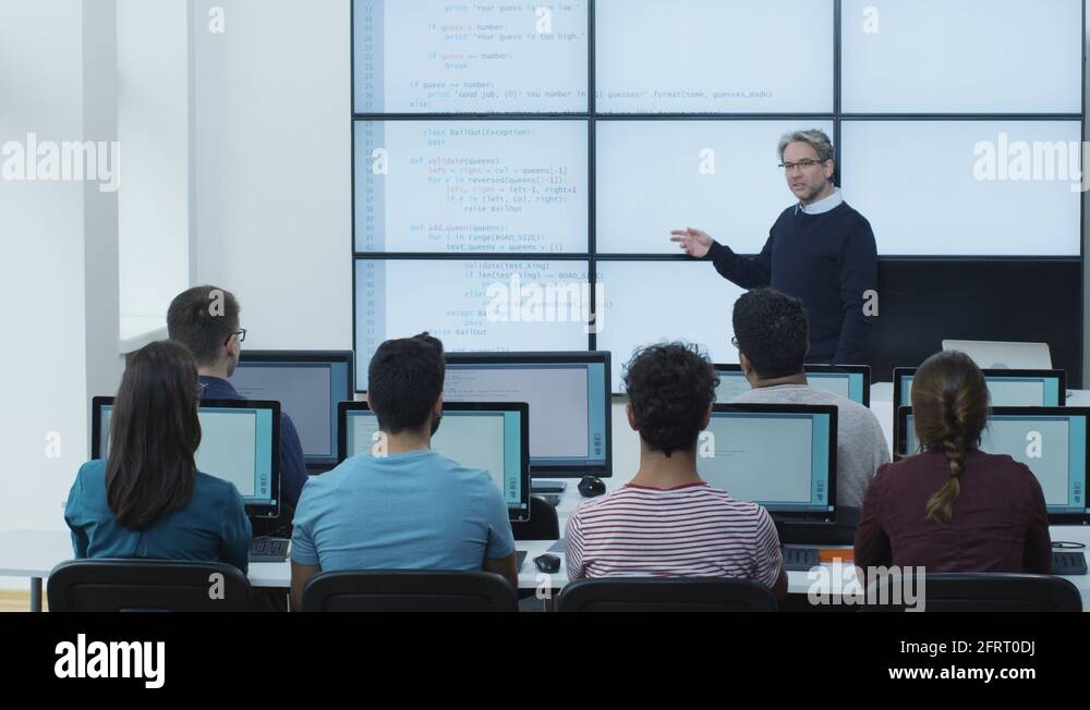 Teacher Speaking about Programming on Lecture in Computer Class Stock ...