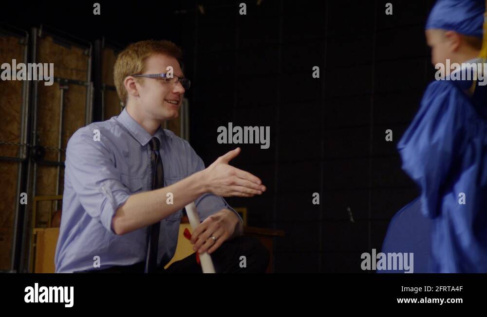 Teacher giving diplomas to small children graduates Stock Video Footage ...