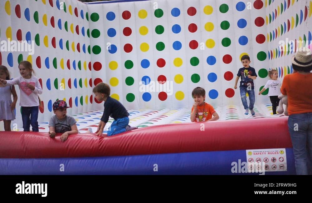 Kids having fun on trampoline, jumping, running. Happy childhood ...