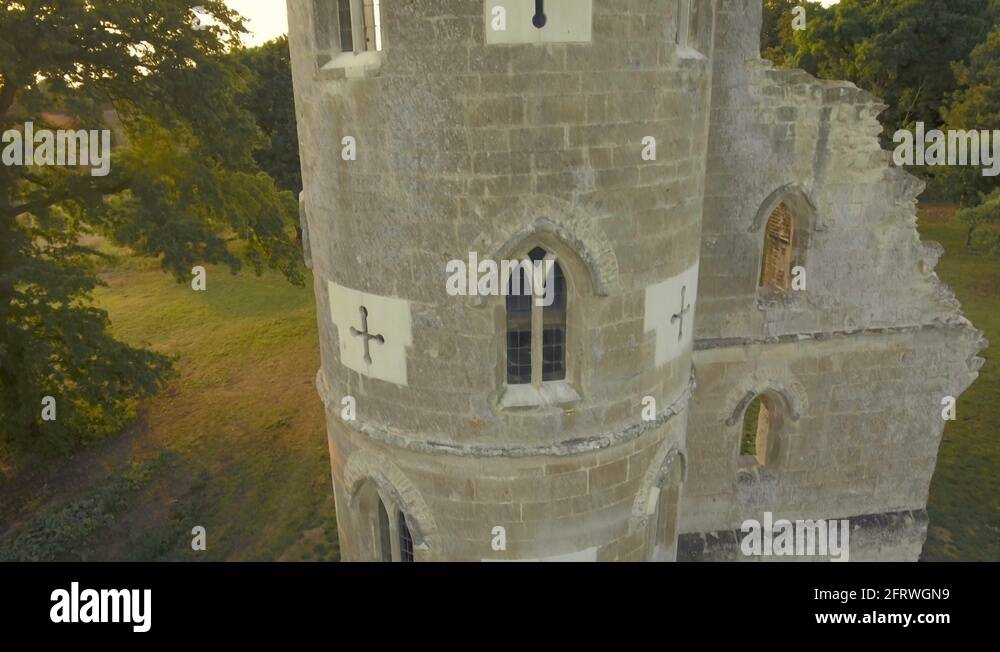 Tower of ruined castle, upwards motion revealing its height, aerial ...