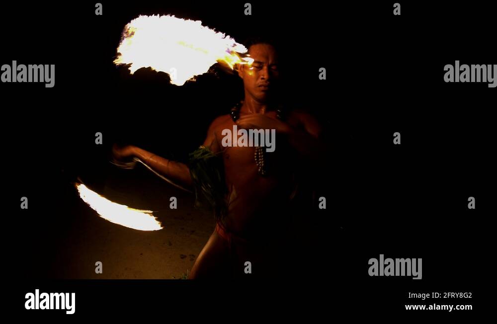 Illuminated flaming torch male Fire dancer performing the Art of Fire ...