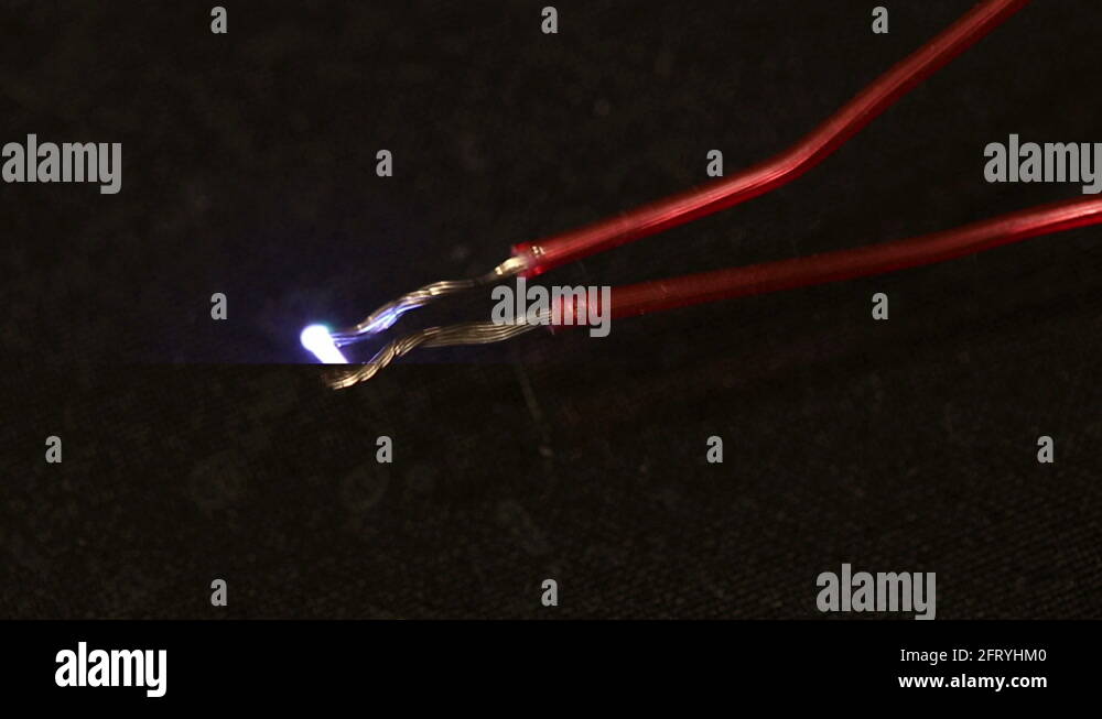 Electrical spark between two insulated wires. Electric arc Stock Video ...