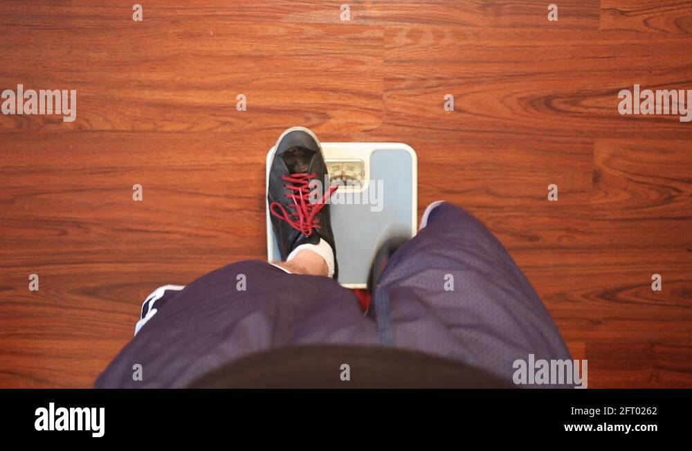 Man weighing himself on scale Stock Videos & Footage - HD and 4K Video ...