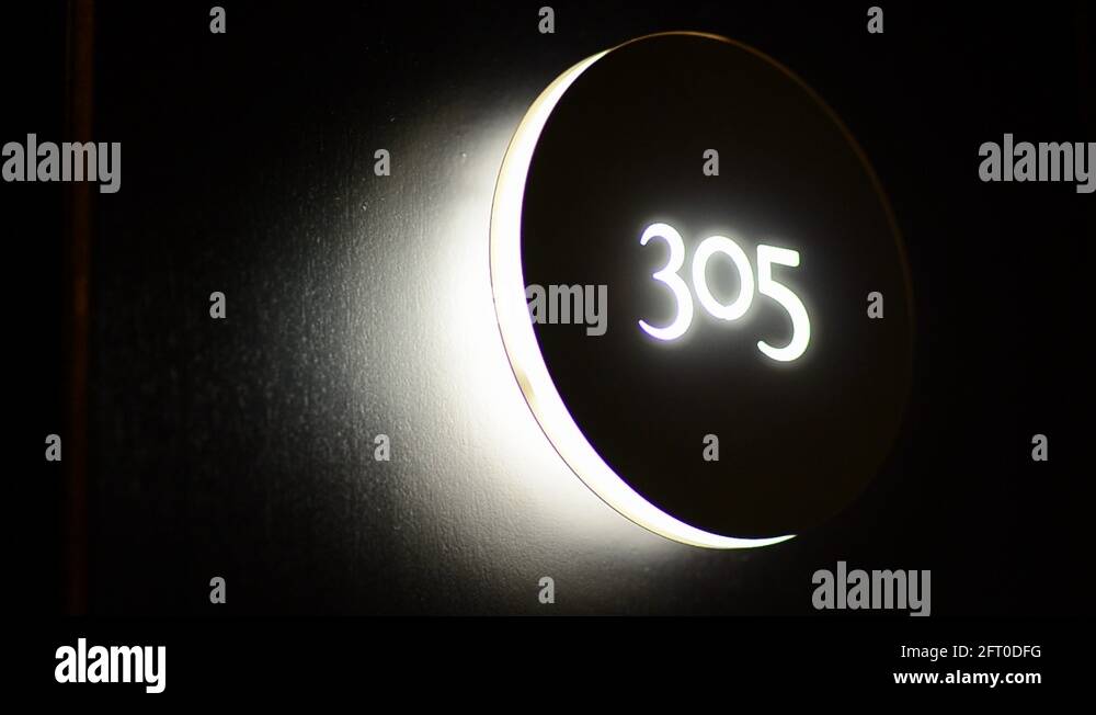 A room number sign for room 305 in a modern hotel Stock Video Footage ...