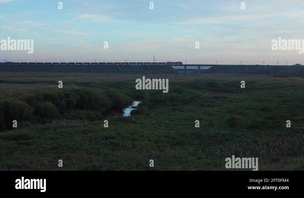 Train crossing a railway bridge in the distance, Trans-Siberian Railway ...