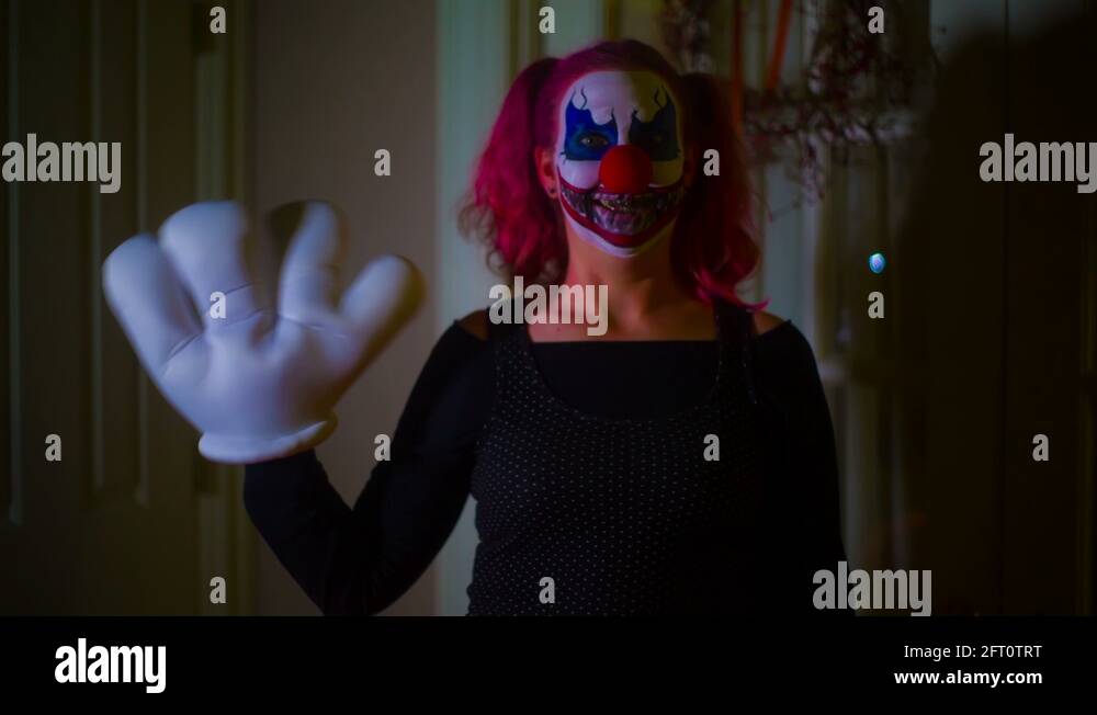 creepy clown wave waving inside Stock Video Footage - Alamy