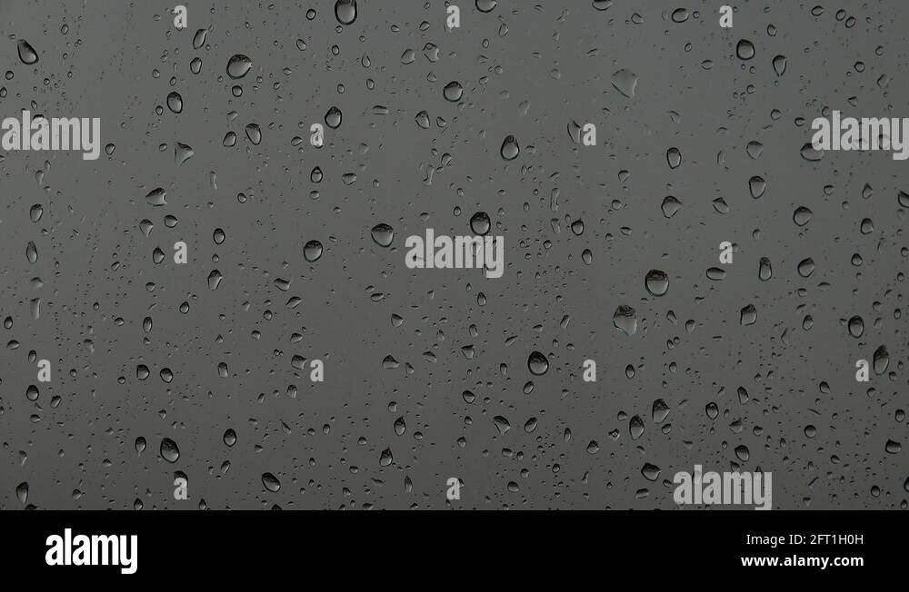 Close up image of rain drops falling on a window , ULTRAHD 4k, real ...