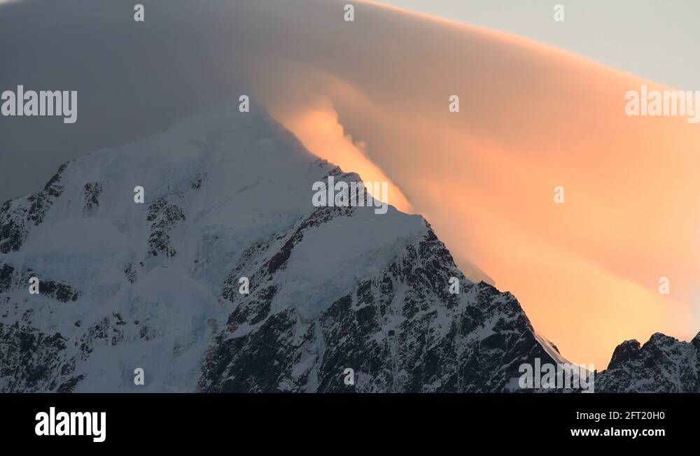 Aoraki, Mount Cook peak with mist forming over mountain peak on sunrise ...