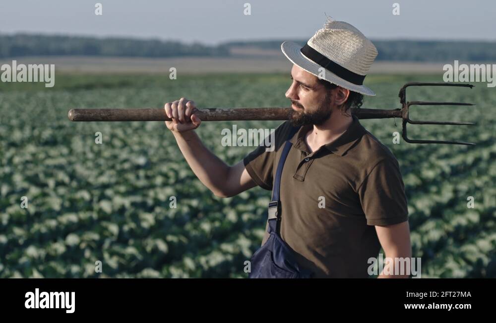 Portrait smiling farmer holding pitchfork Stock Videos & Footage - HD ... Portrait smiling farmer holding pitchfork Stock Videos & Footage - HD ...