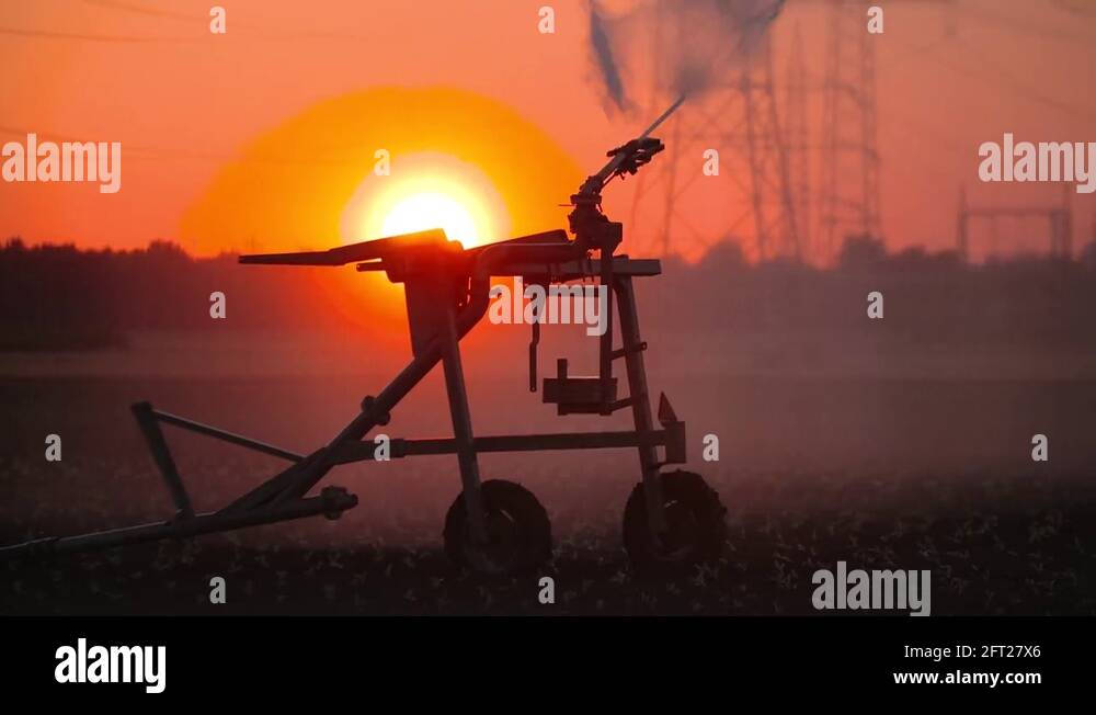 Industrial farming: excessive use of water in a sprinkling machine with ...