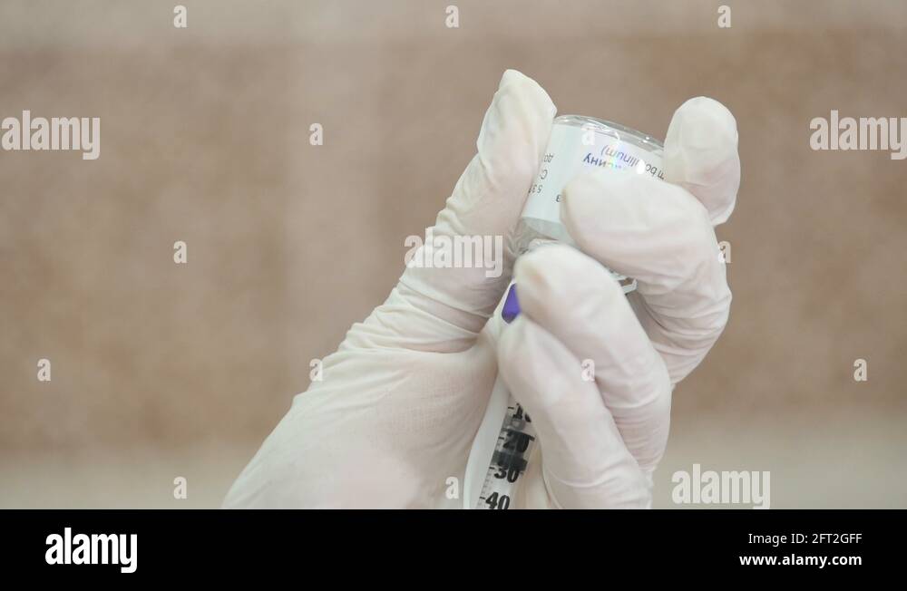 Medical doctor or nurse loading syringe for injection Stock Video ...