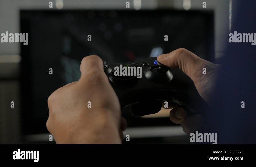 Man playing a video game using a game controller. With TV. Console ...