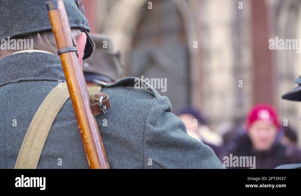 Close up to rifleman with vintage gun. Historic procession military ...