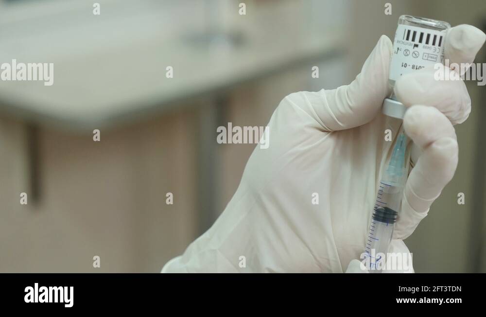 Medical doctor or nurse loading syringe for injection Stock Video ...