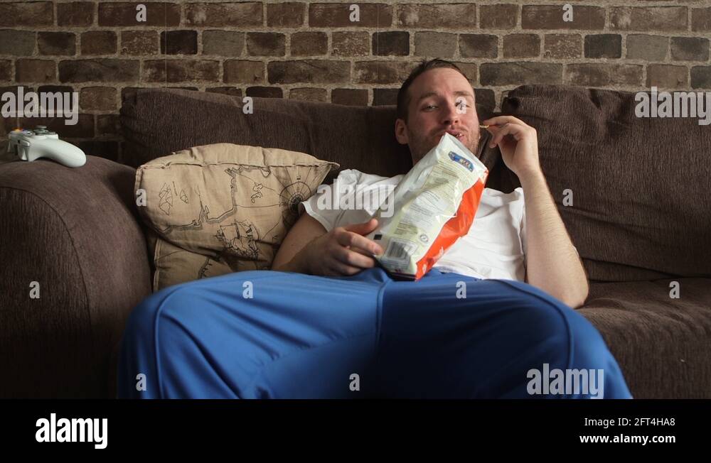 Lazy man couch eating Stock Videos & Footage - HD and 4K Video Clips ...