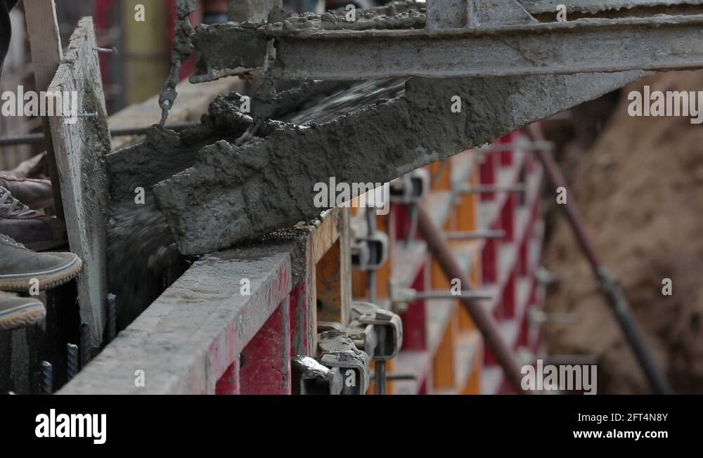 Construction, workers is poured concrete into the formwork Stock Video ...
