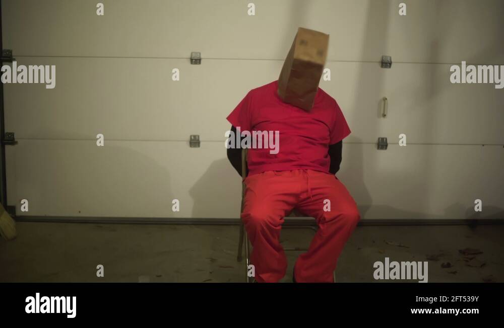 prisoner prison in chair punishment Stock Video Footage - Alamy