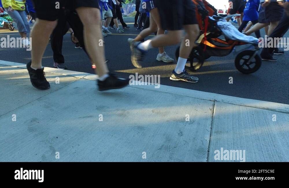 A crowd of people running in a 10K race Stock Video Footage - Alamy