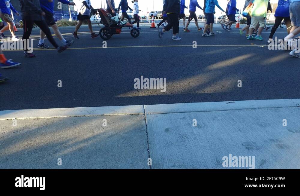 A crowd of people running in a 10K race Stock Video Footage - Alamy