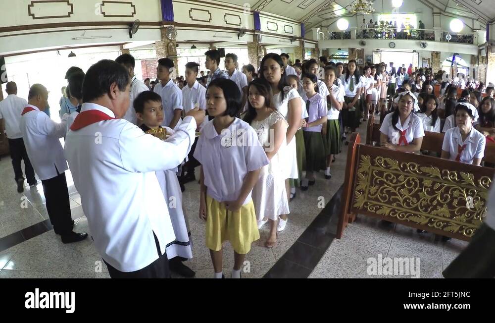 Young girls receive sacrament of communion Stock Video Footage - Alamy