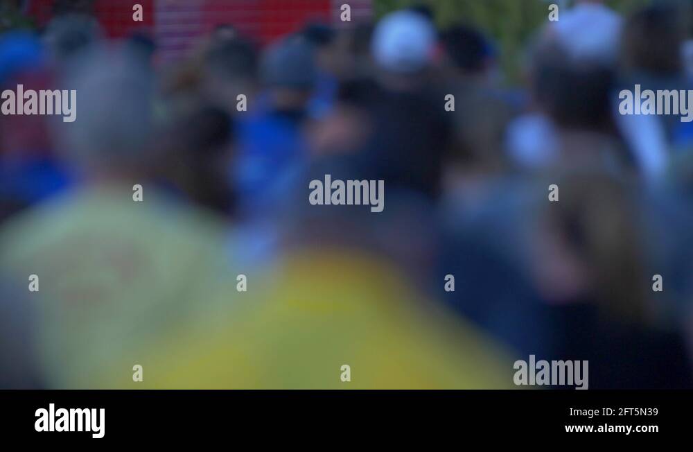 The back of a crowd of people running in a 10K race, slow motion Stock ...