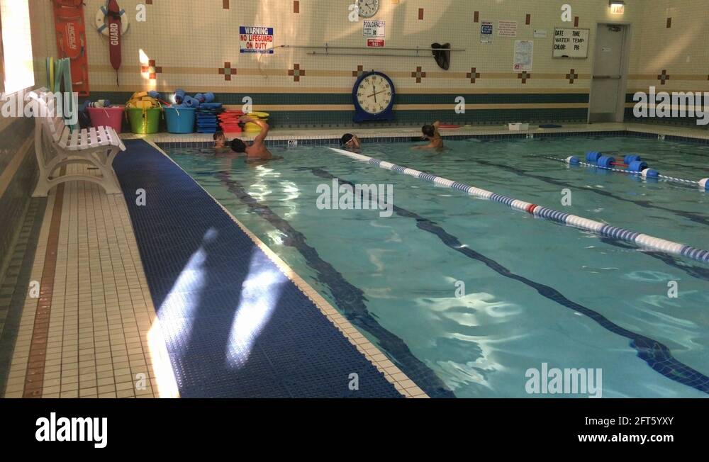 Boys have swimming lessons in a pool Stock Video Footage - Alamy