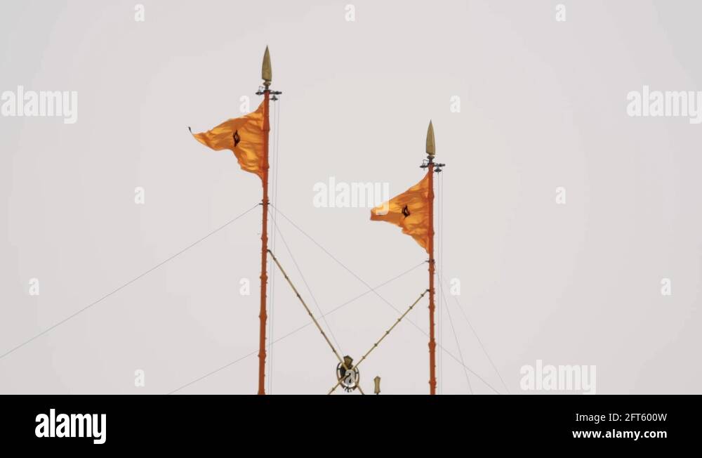 The Nishan Sahib Sikh flag on high flagpole, Golden Temple, Amritsar ...