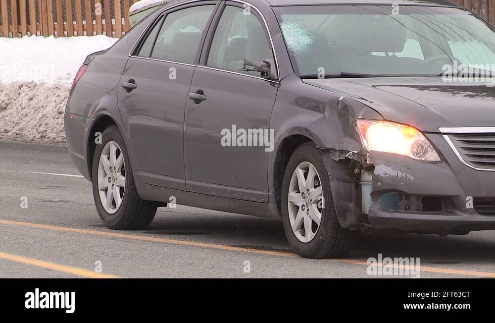 Police officers at scene of pedestrian stuck and killed by car on city ...