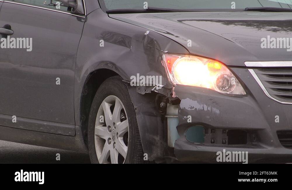 Police officers at scene of pedestrian stuck and killed by car on city ...