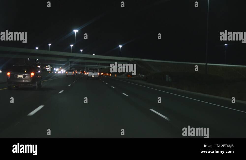 Driving on HWY 401 at night. Going under bridges. Toronto, Canada Stock ...