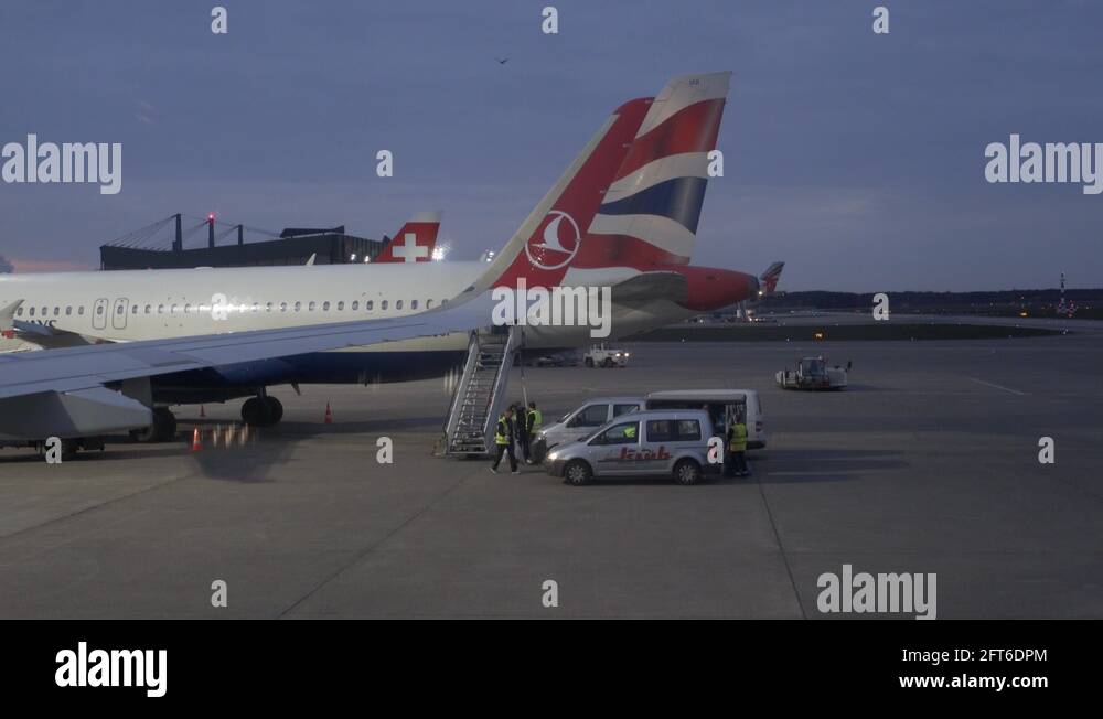 Ground crew removes trash garbage from British Airways plane, Tegel ...