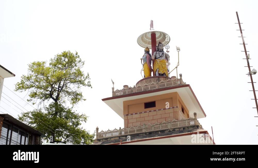 Tower with statue of Shiva Hindu gods, Ram Jhula skyline, Rishikesh ...