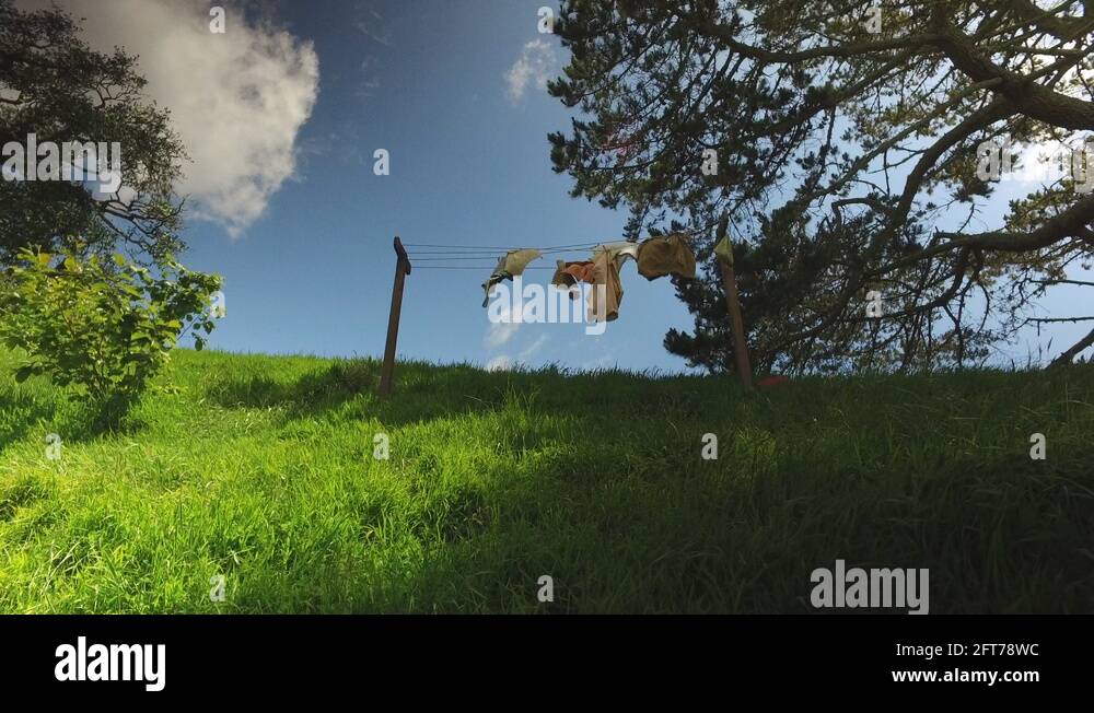 Clothes Drying Outdoors On A Washing Line Windy Day Stock Video Footage ...