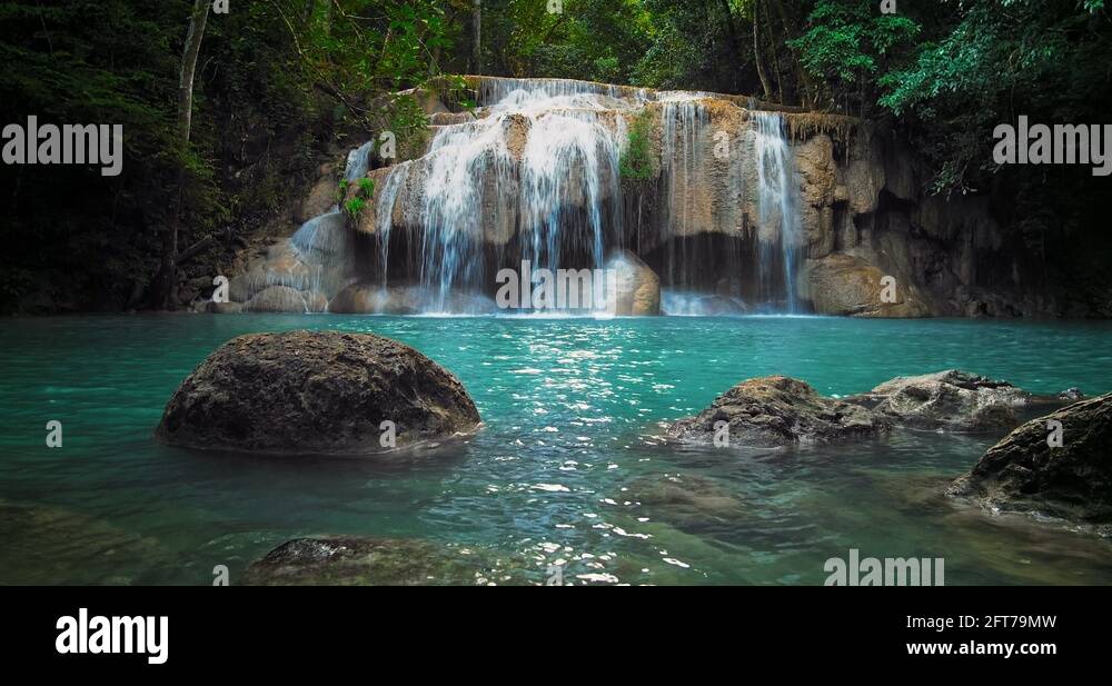 Pristine waterfall with pure clean water pond in tropical forest 4K ...
