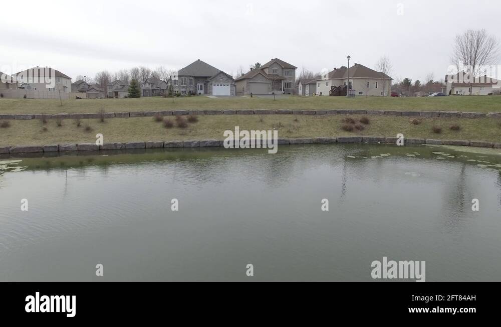 real estate flight speed ramped over water and showing roof reveal 4k ...