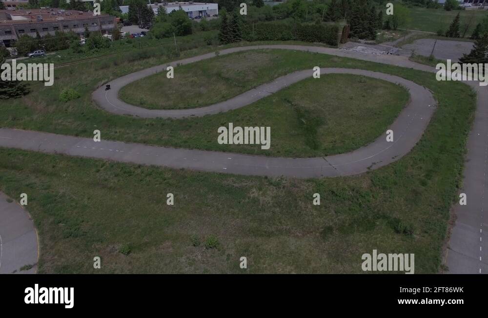 aerial motorcycle race track overview with bike riding solo 4k Stock ...