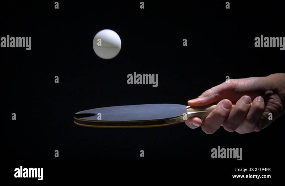 Hand holding table tennis racket and bouncing ping pong ball Stock ...