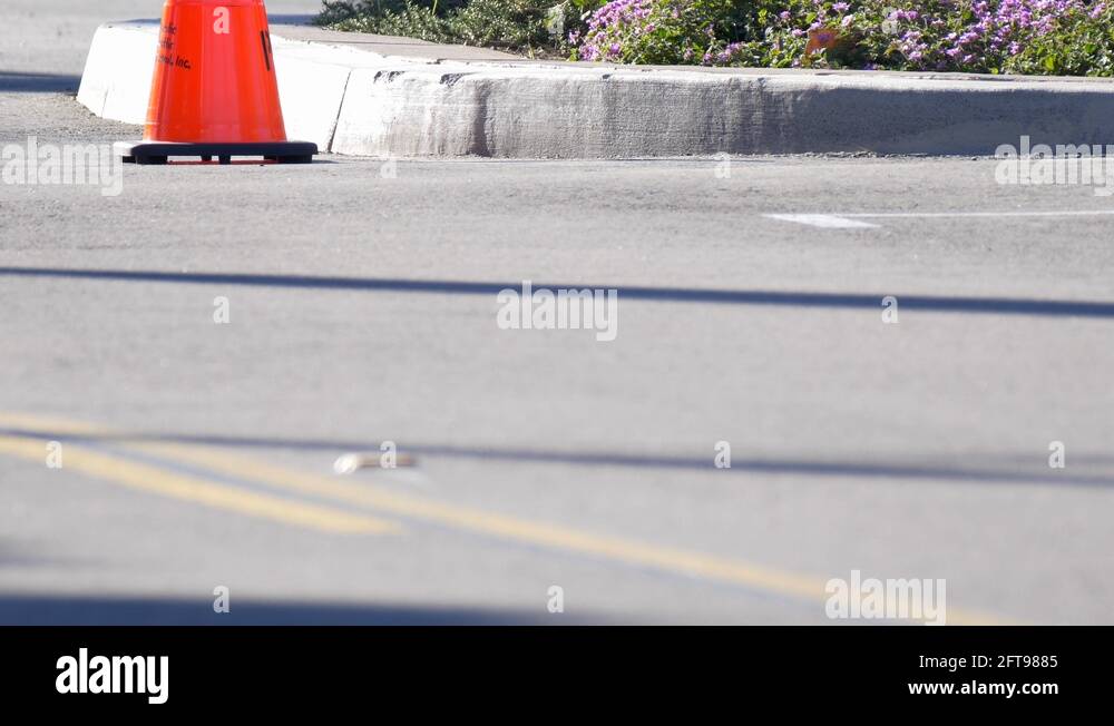 Orange traffic cones in the street at a 10K running race Stock Video ...