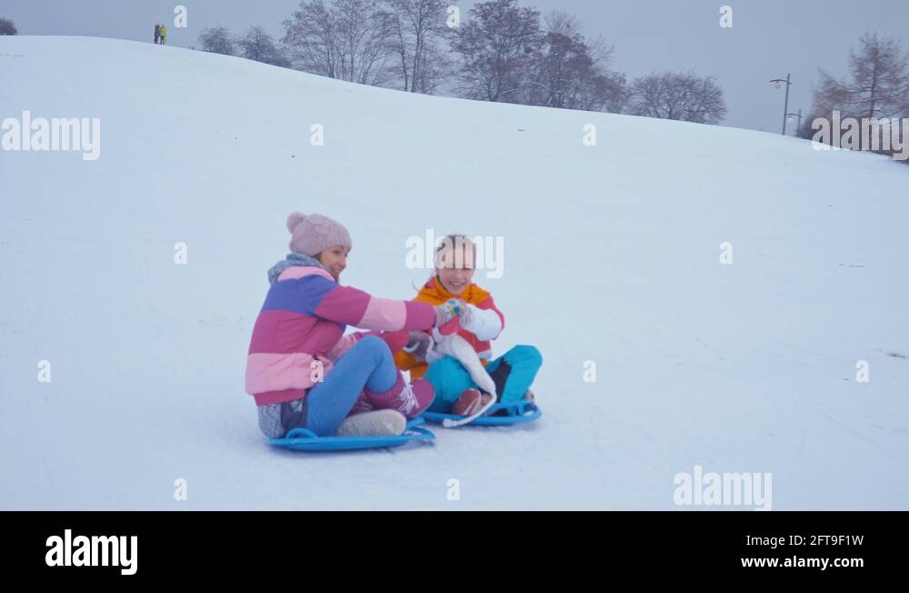 Family sliding snow Stock Videos & Footage - HD and 4K Video Clips - Alamy