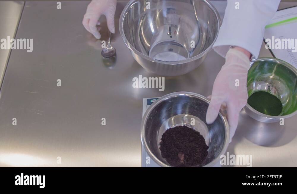 Putting two items into one big container Stock Video Footage - Alamy